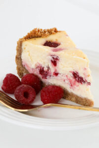 The ULTIMATE Raspberry Baked Cheesecake Recipe! - Bake Play Smile
