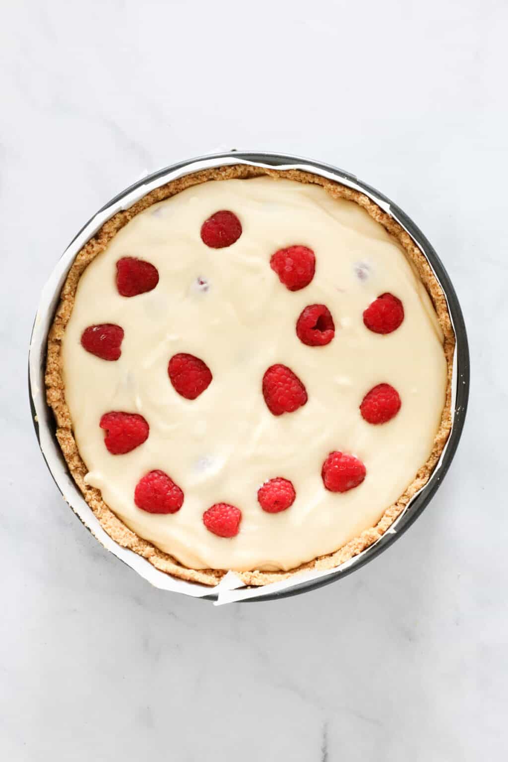 The ULTIMATE Raspberry Baked Cheesecake Recipe! - Bake Play Smile