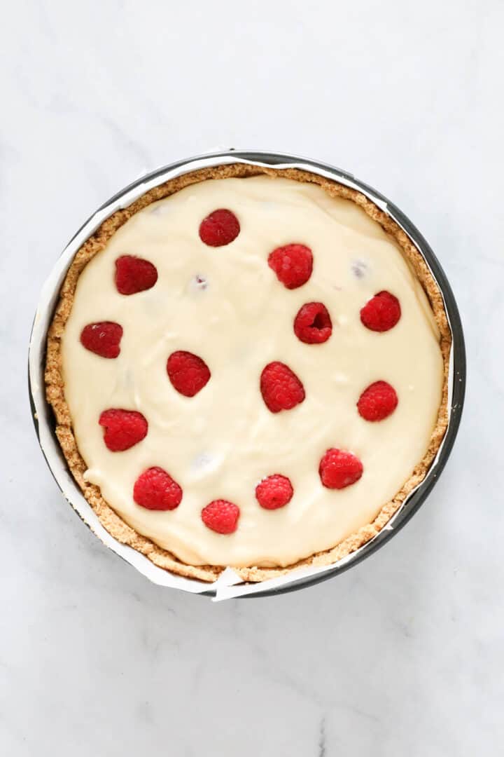 The ULTIMATE Raspberry Baked Cheesecake Recipe! - Bake Play Smile